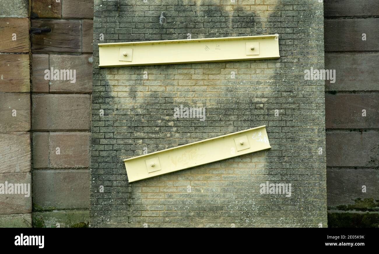 Buttressed wall reinforced with steel bars Stock Photo - Alamy