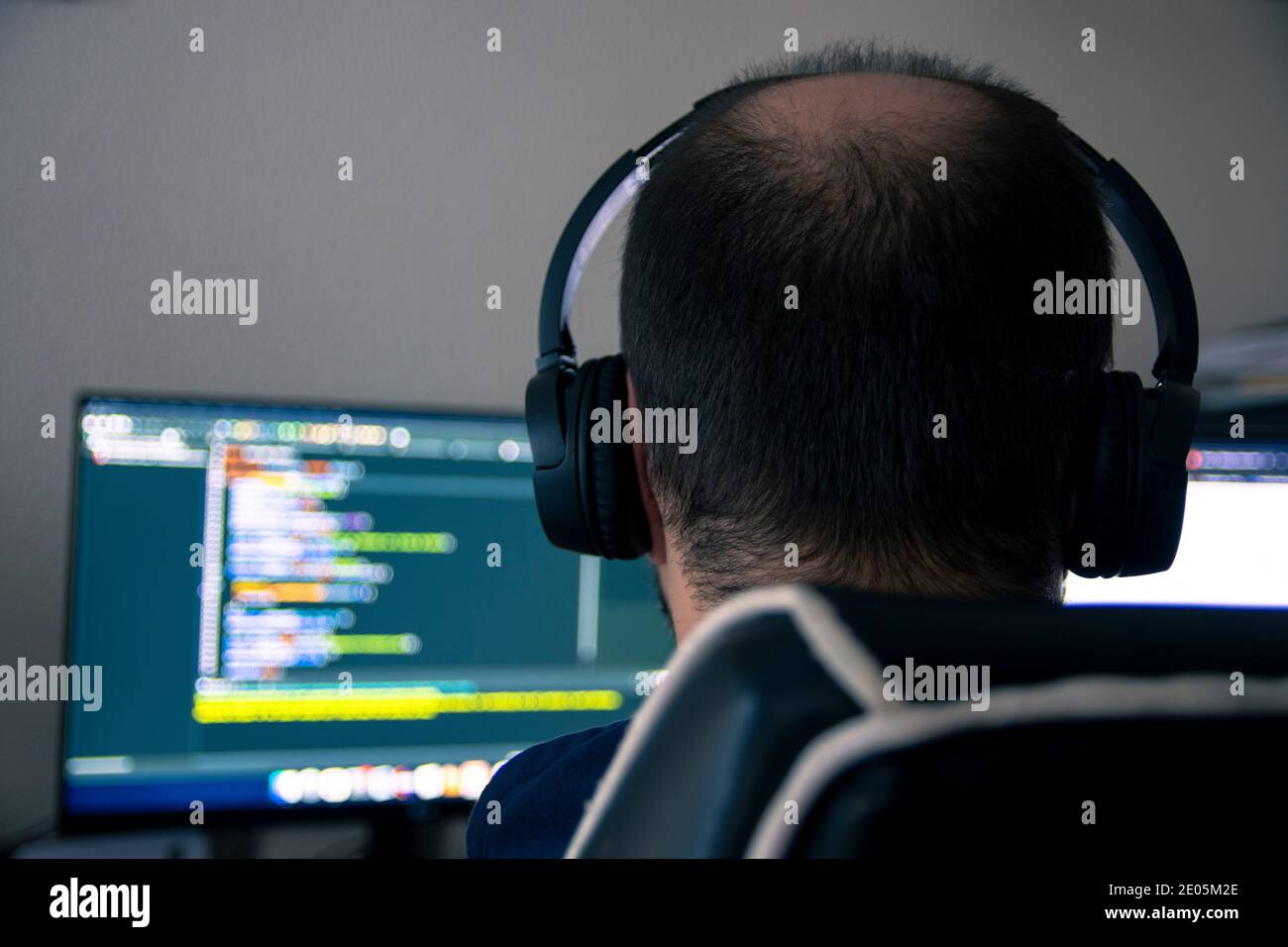 Man on laptop learning from behind hi-res stock photography and images ...