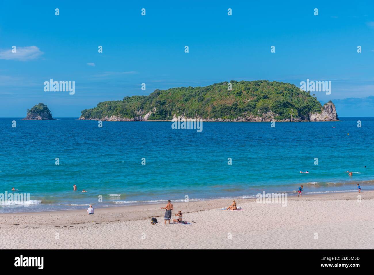 HAHEI, NEW ZEALAND, FEBRUARY 16, 2020: People strolling at Hahei beach ...