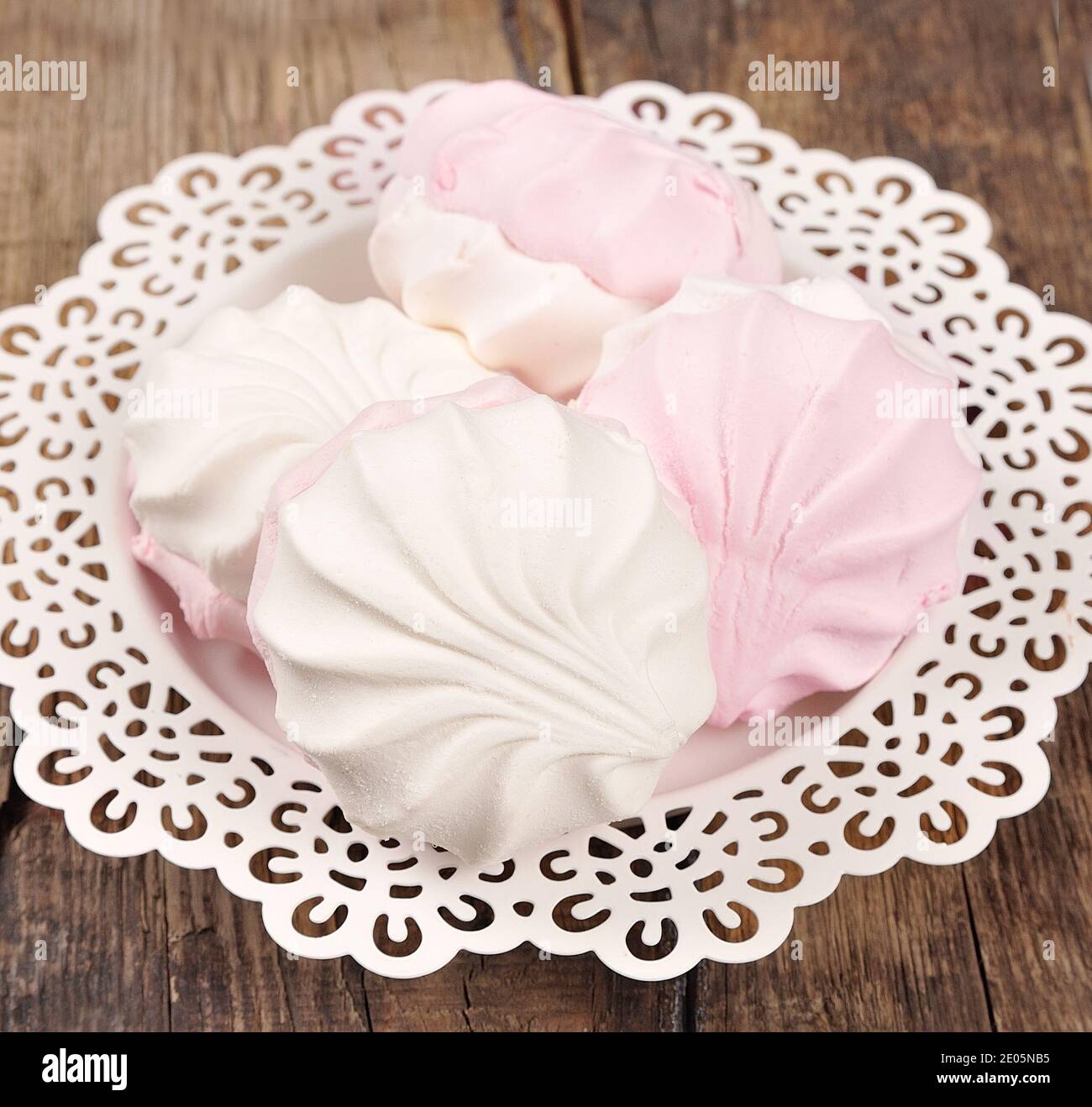 Zephyr. Mallow. Dessert on a wooden background Stock Photo - Alamy