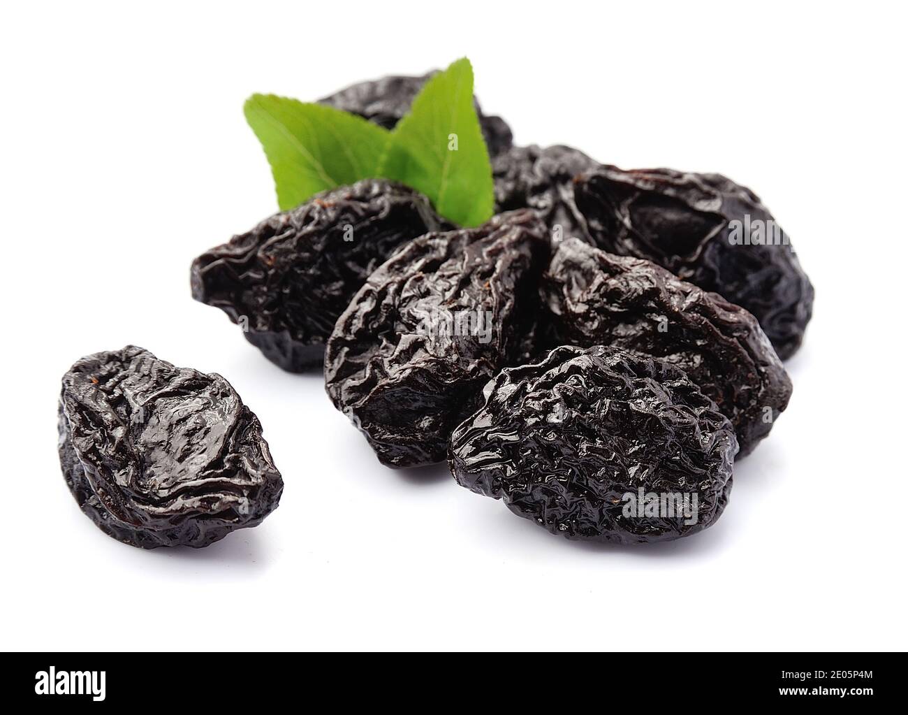 Dry plums isolated on white backgrounds Stock Photo - Alamy