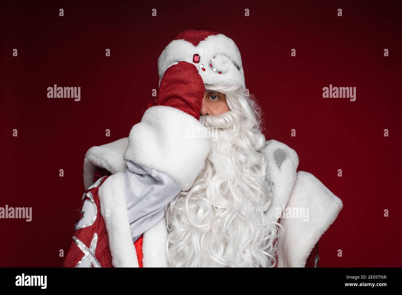Santa covering on half of his face Stock Photo - Alamy