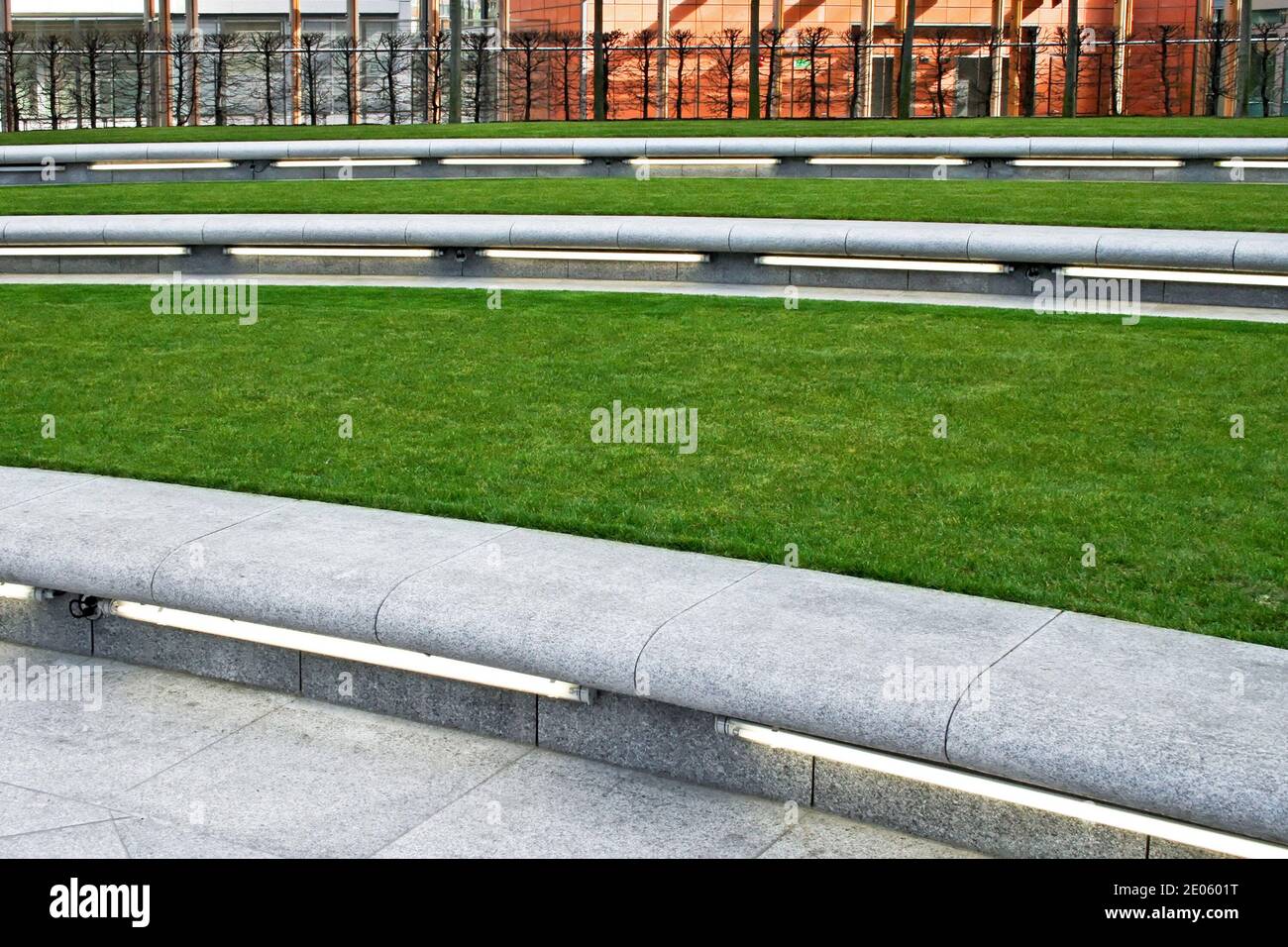 Grass area in park with concrete bench Stock Photo - Alamy