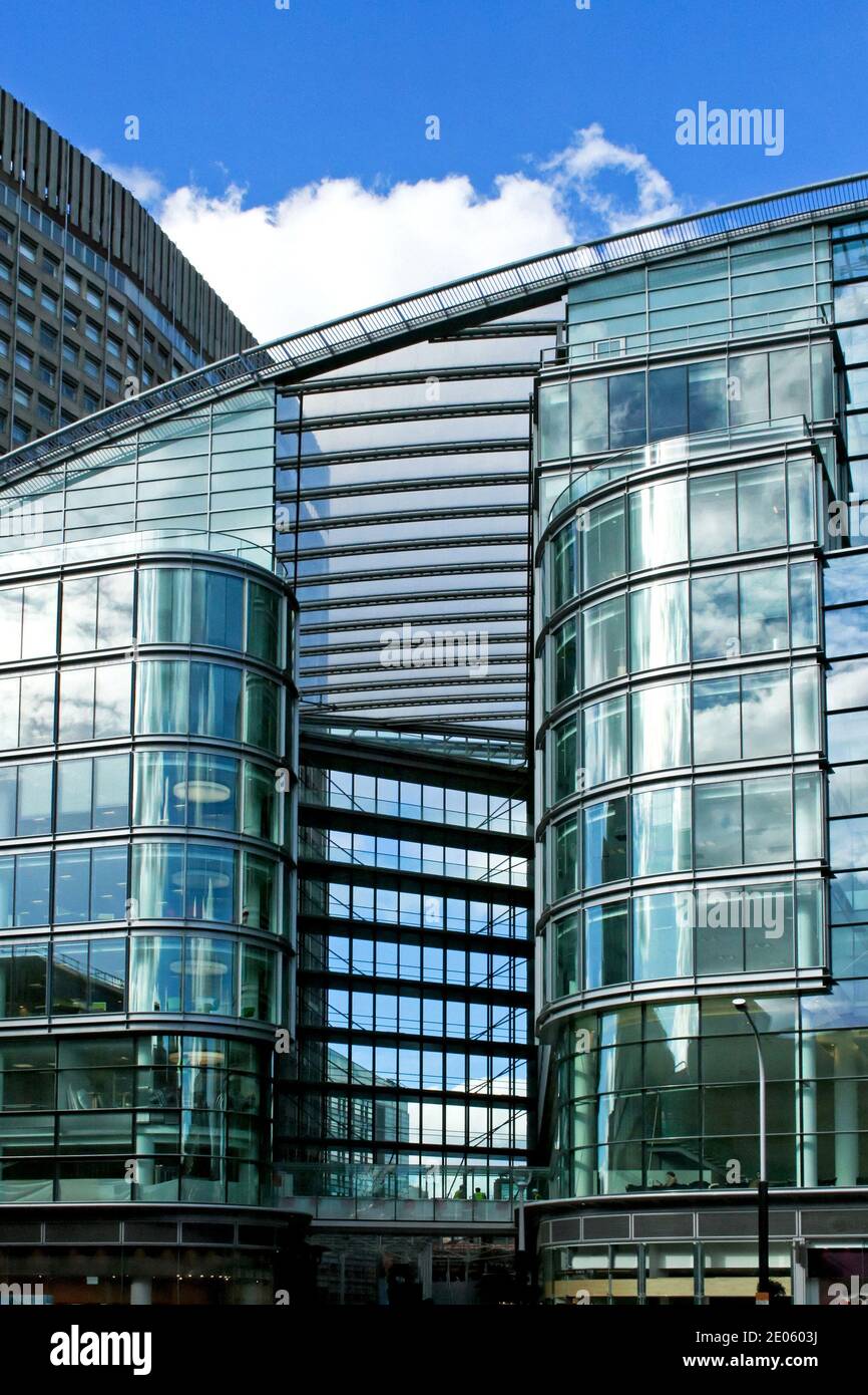 Business building passage all in windows and glass Stock Photo - Alamy