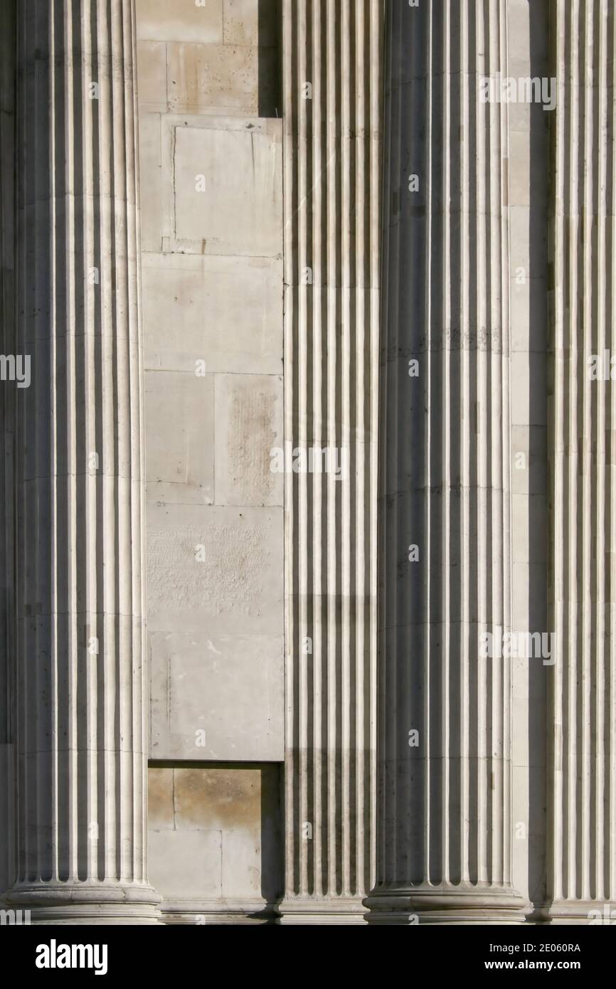 Grey ancient Ionic columns background line up Stock Photo - Alamy