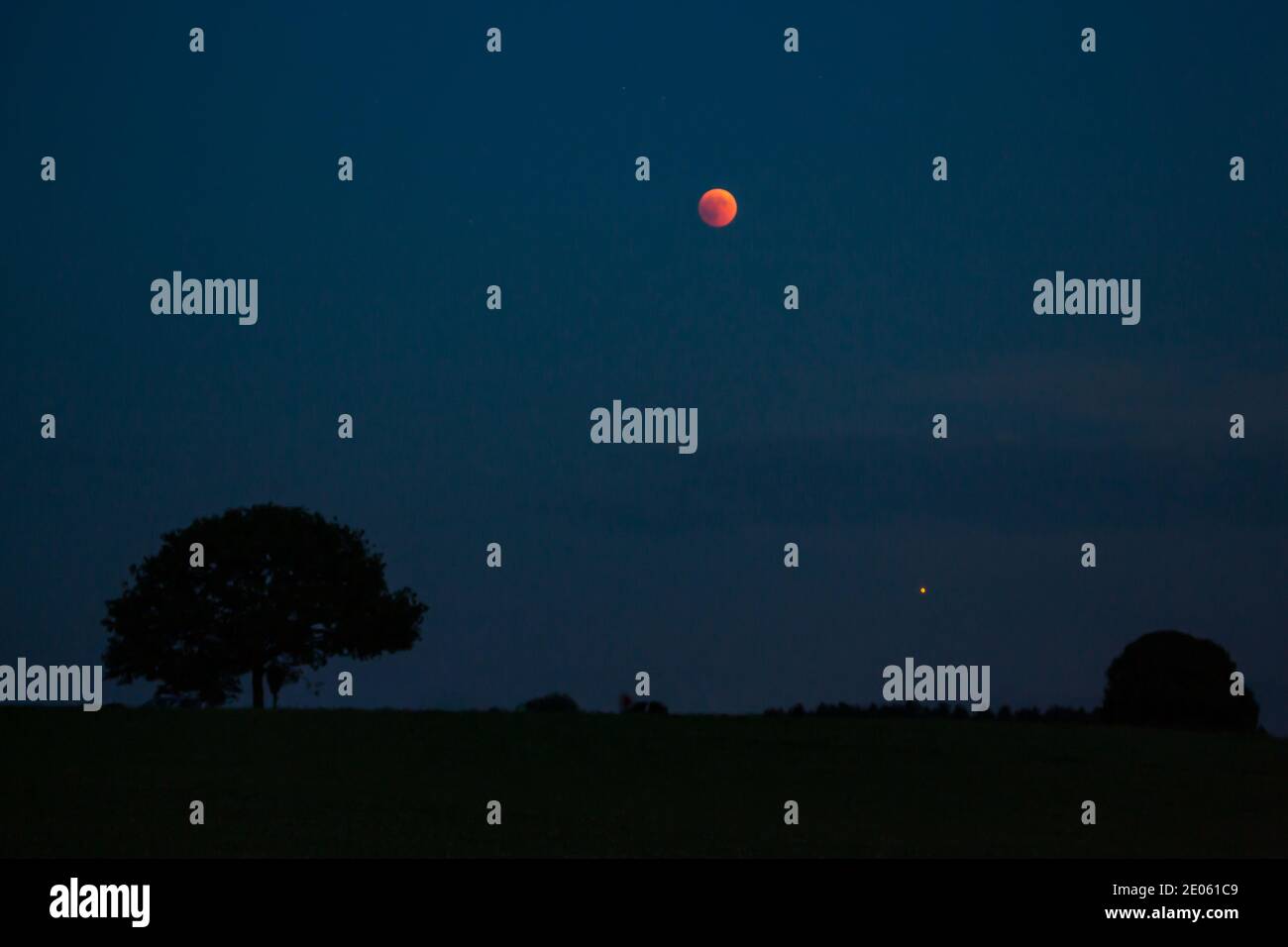 Blood moon and Mars glowing during total lunar eclipse over Germany ...