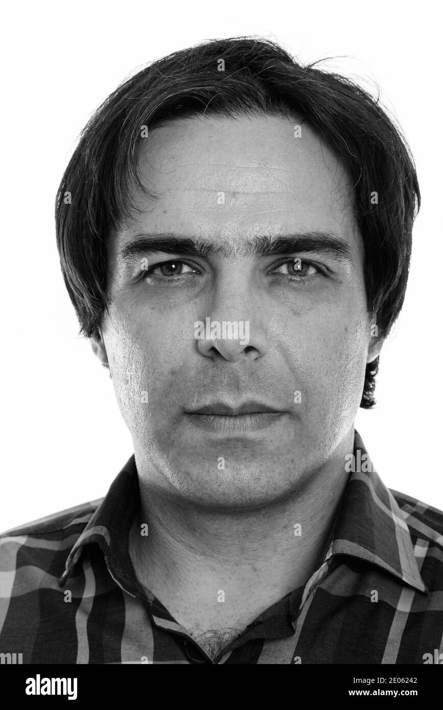 Studio shot of face of young Persian man Stock Photo - Alamy