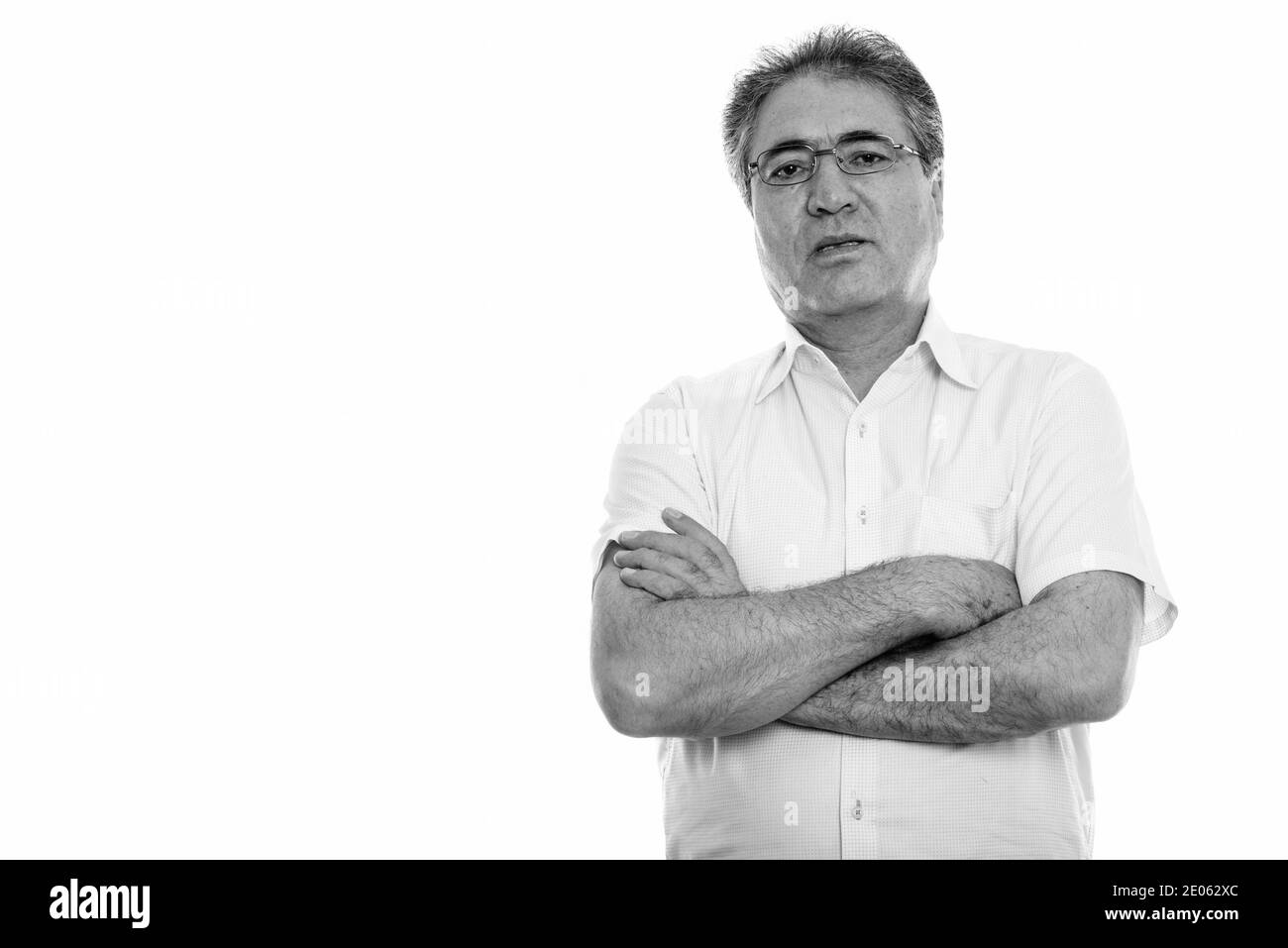 Old person arms crossed Black and White Stock Photos & Images - Alamy