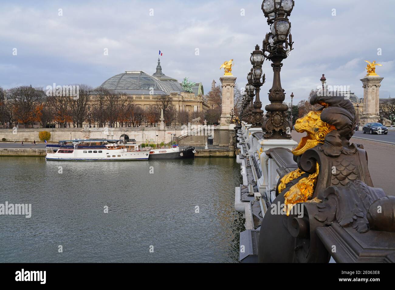 PARIS, FRANCE -18 DEC 2020- Ornate black and gold statues on the Pont ...