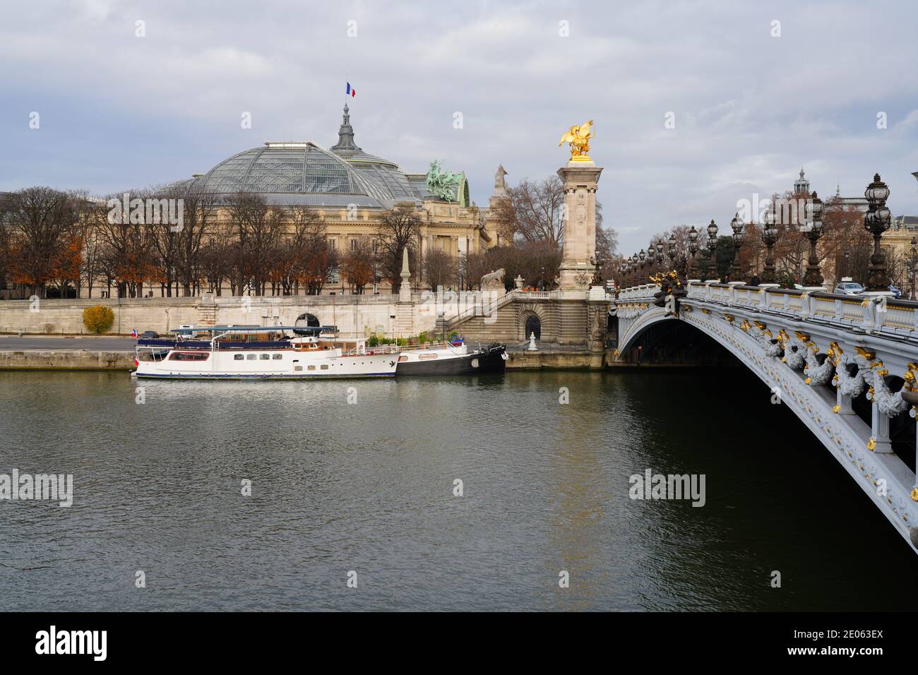 PARIS, FRANCE -18 DEC 2020- Ornate black and gold statues on the Pont ...