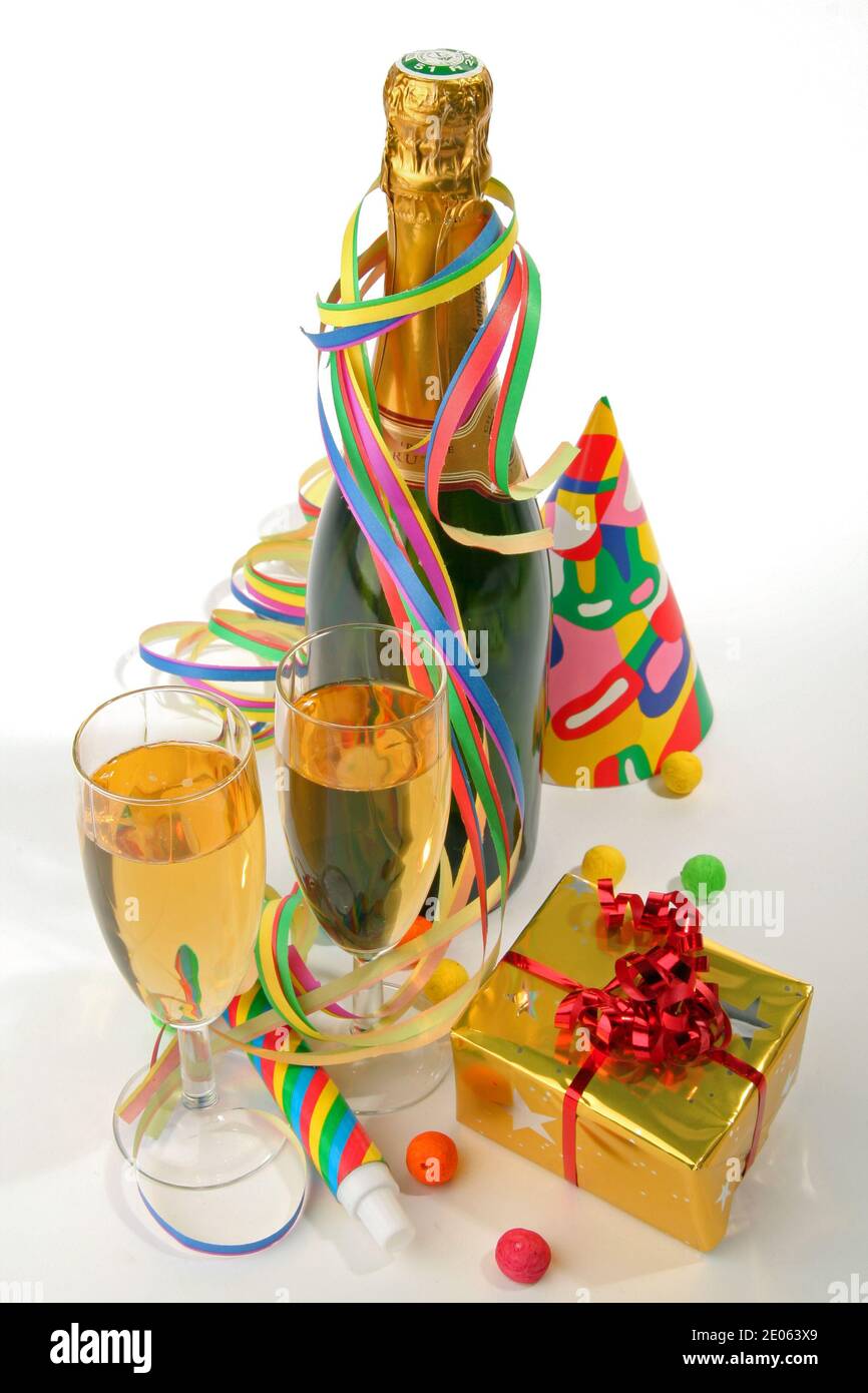 New Year party concept with bottle and glass of champagne, paper ribbon ...