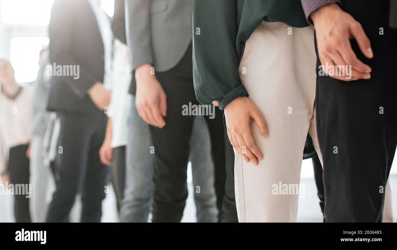 image of young business people standing in a long queue Stock Photo - Alamy