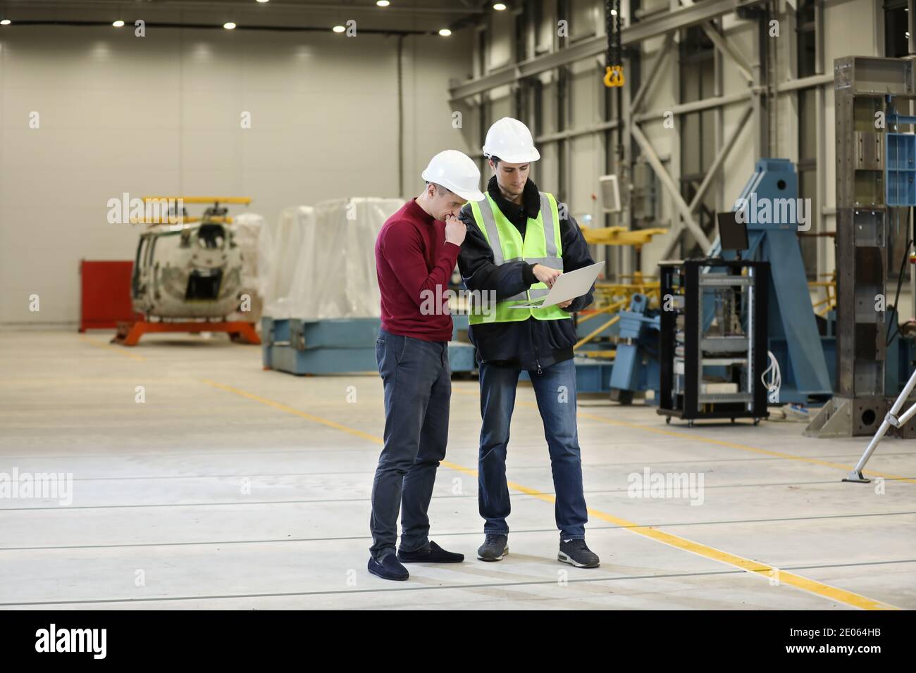 Standing holding working teamwork aerospace industry hi-res stock ...