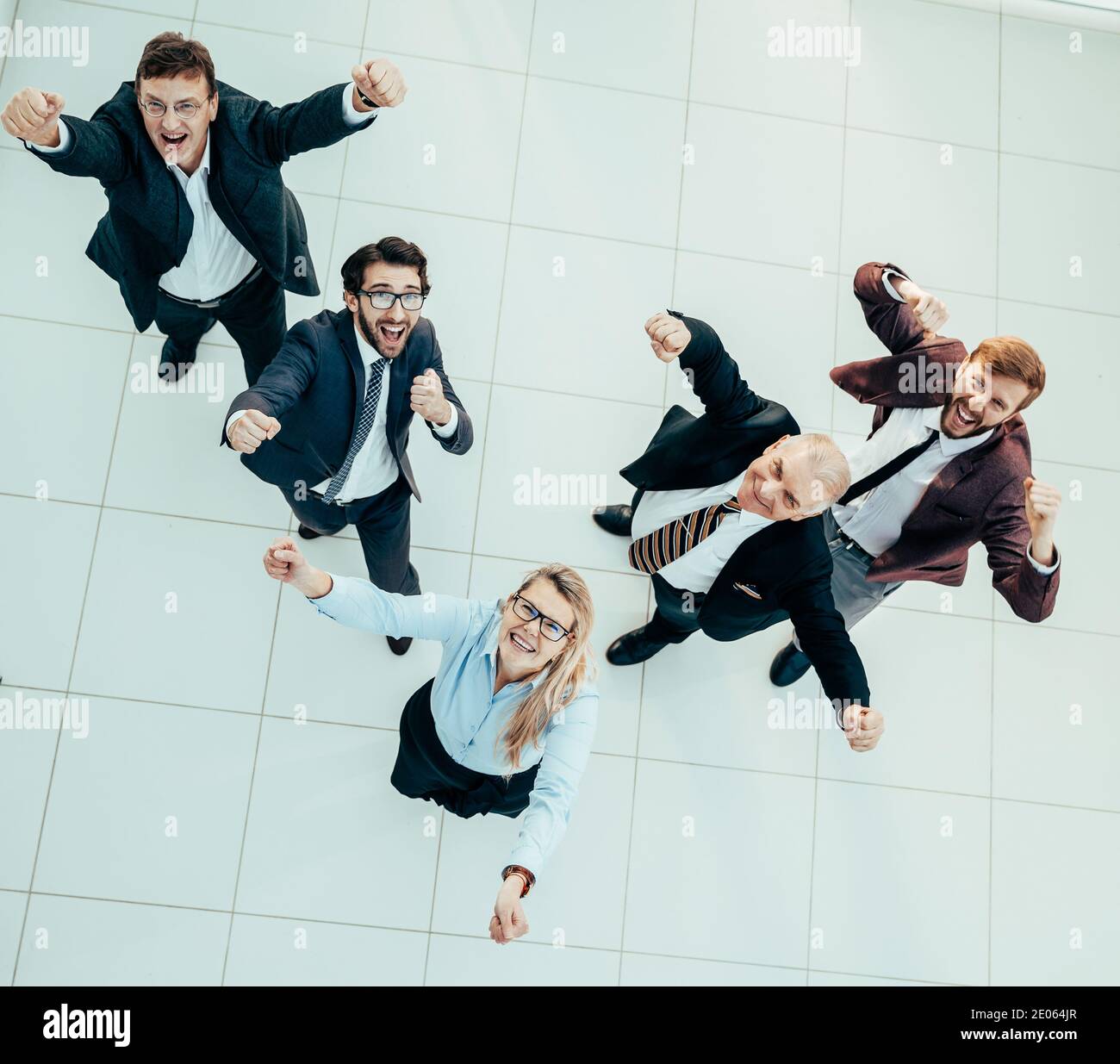 top view. group of happy people showing their success Stock Photo - Alamy