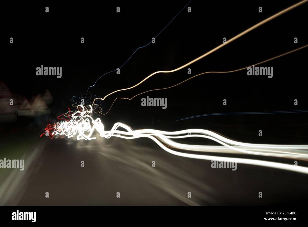 Driving at night view from inside car of distorted blurry fuzzy vision ...