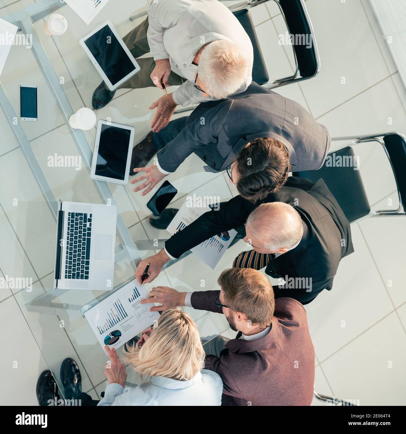 top view. group of employees analyzing financial performance Stock ...
