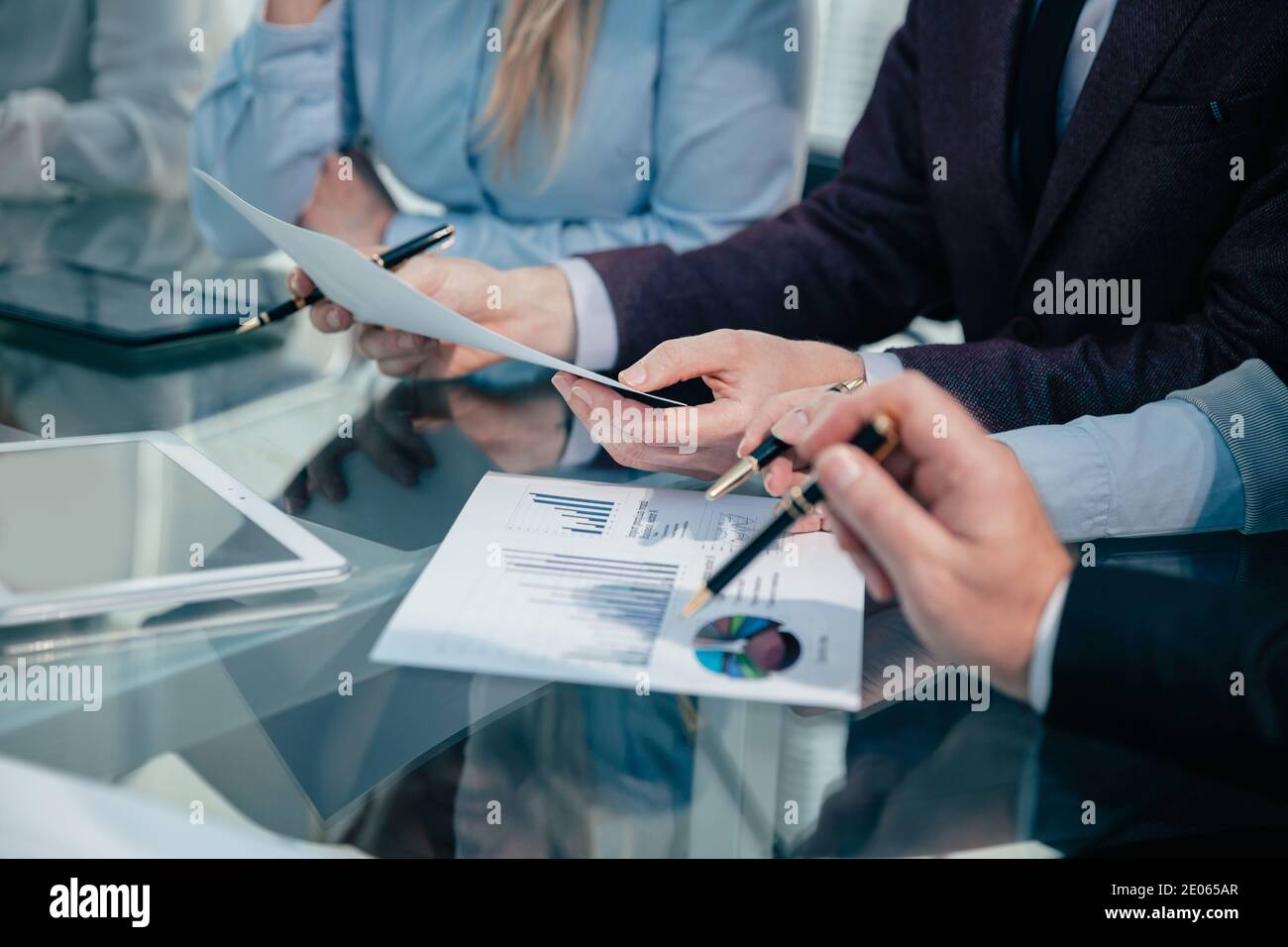 Business people checking charts hi-res stock photography and images - Alamy