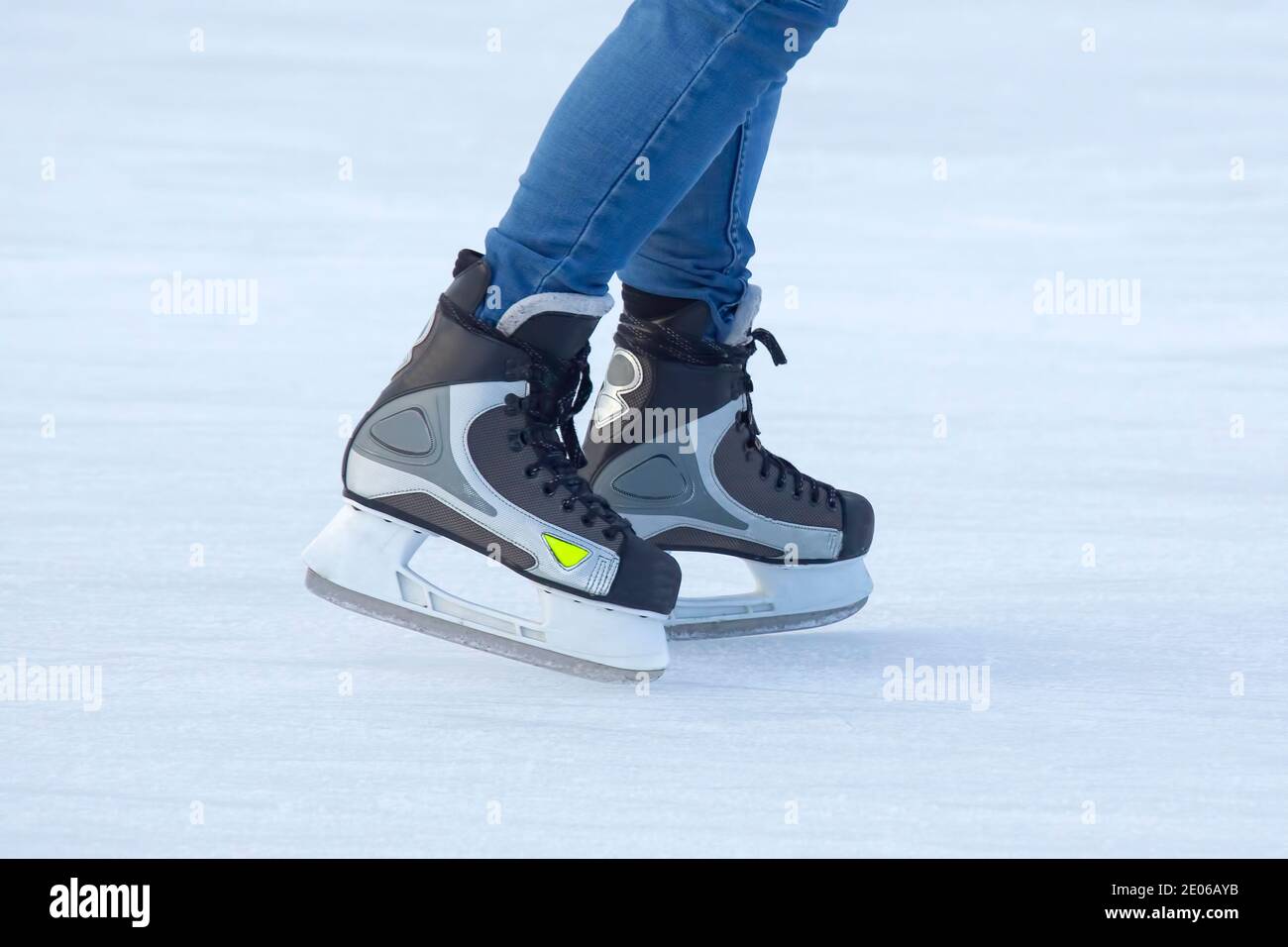Legs of a man skating on an ice rink. Hobbies and sports. Vacations and ...