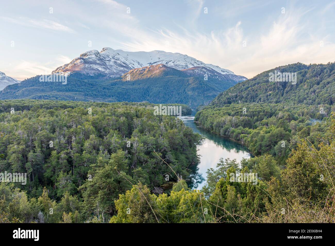 Landscape view of Arrayanes river against snowcapped Andes Mountains in ...