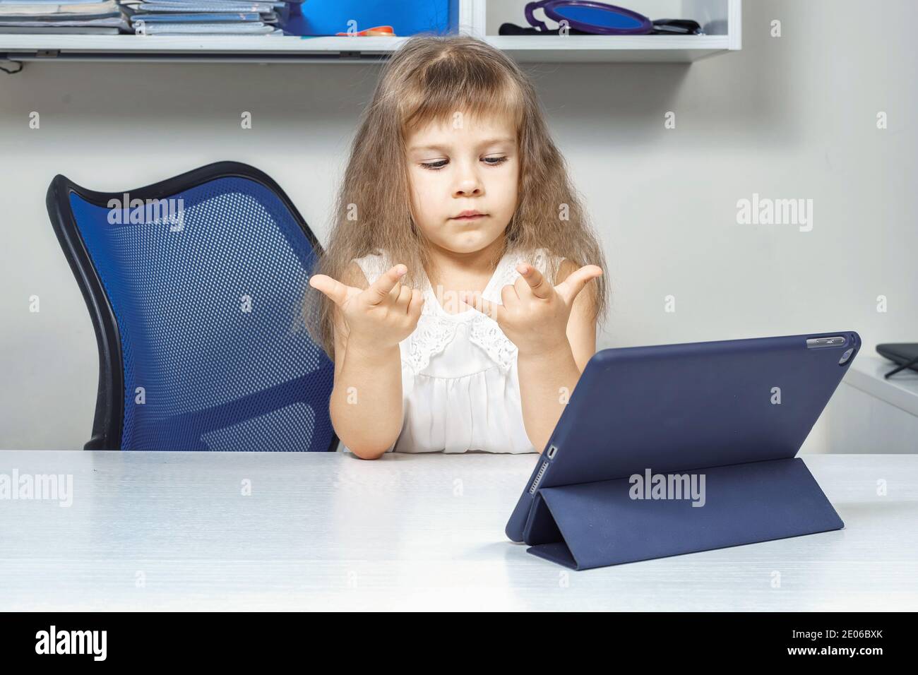 little girl doing mental arithmetic online. children's creativity Stock ...