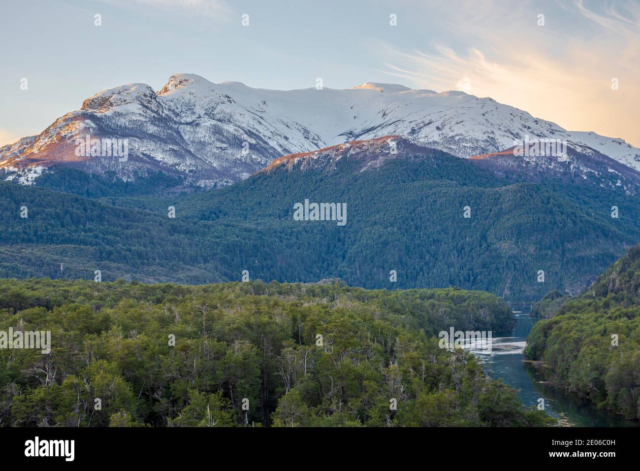 Landscape view of Arrayanes river against snowcapped Andes Mountains in ...