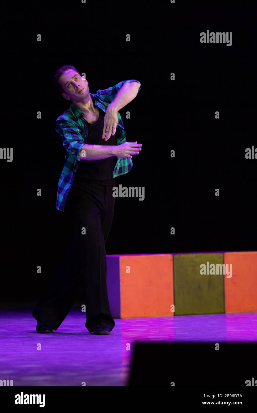 Actor dancer young man performs in the theater on stage in a dance ...