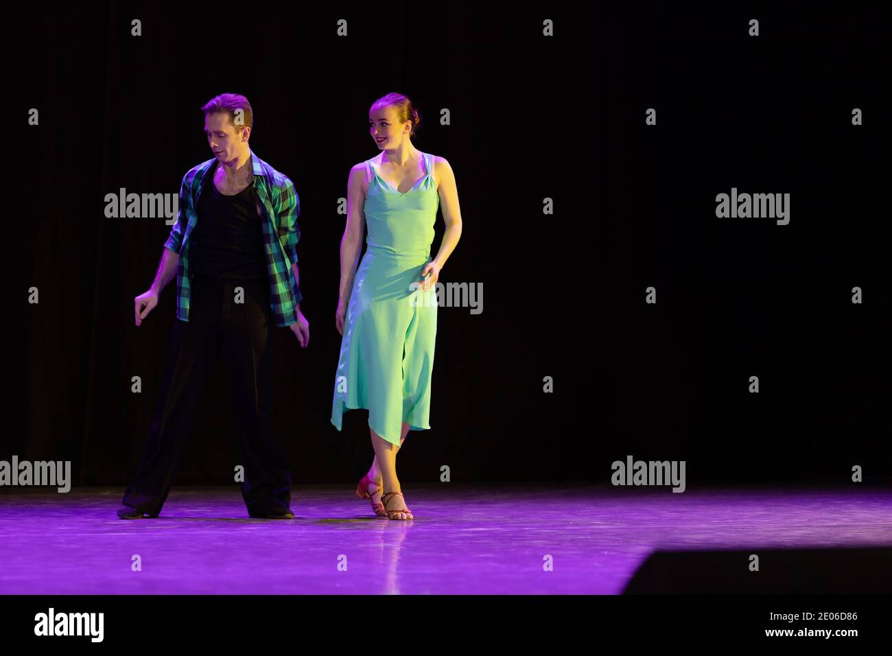 dancers a man and a woman perform in a theater on stage in a dance ...