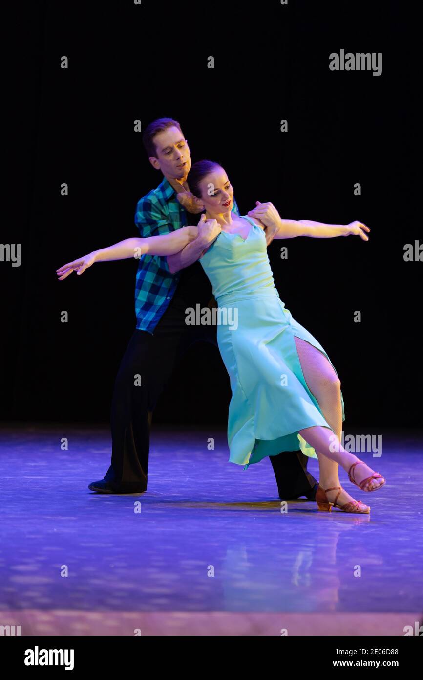 dancers a man and a woman perform in a theater on stage in a dance ...