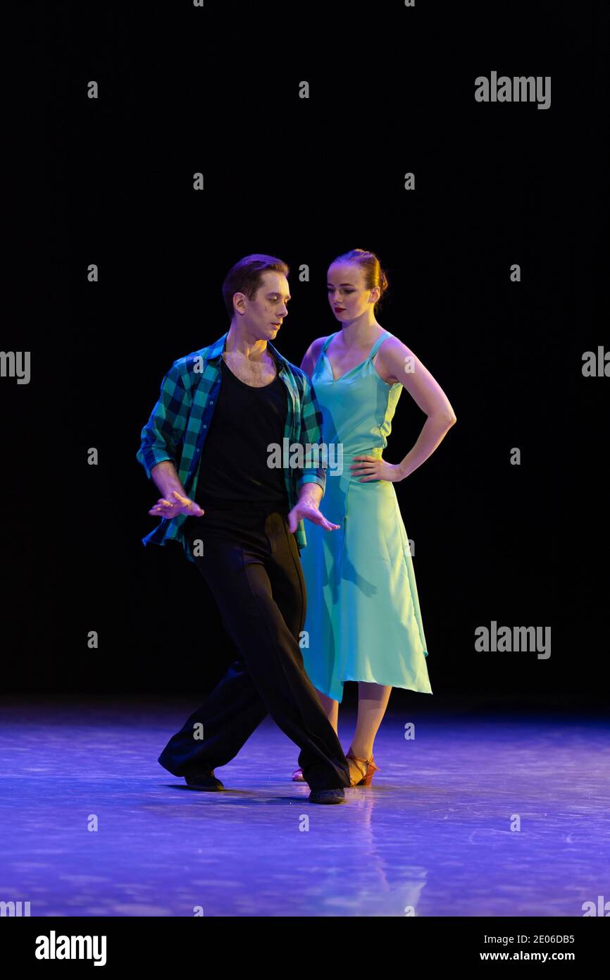 dancers a man and a woman perform in a theater on stage in a dance ...