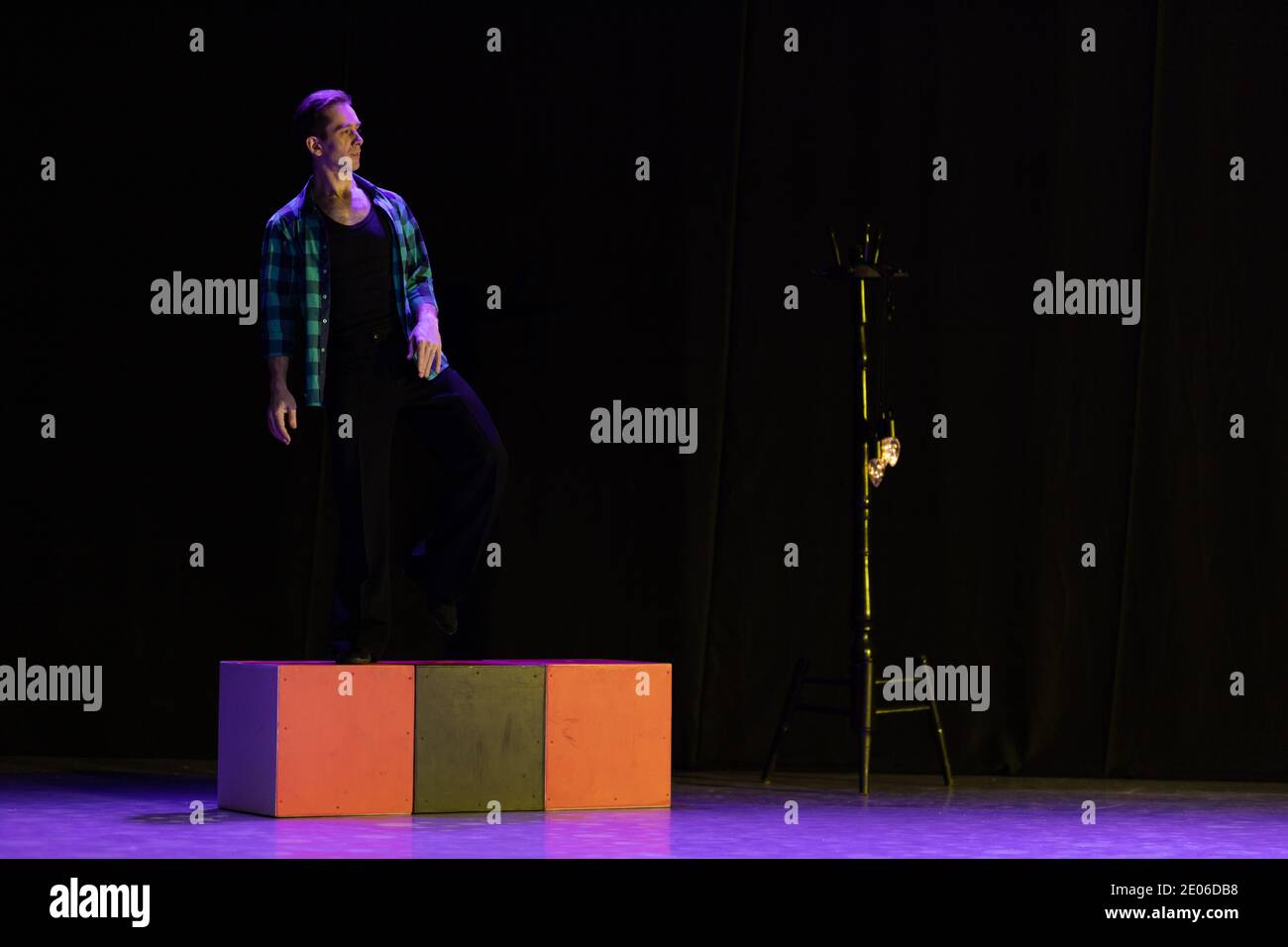 Actor dancer young man performs in the theater on stage in a dance ...