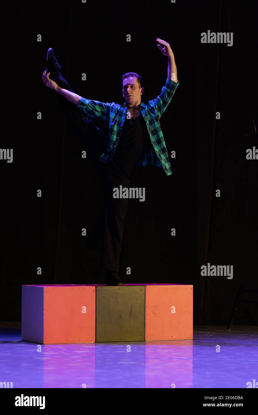 Actor dancer young man performs in the theater on stage in a dance ...