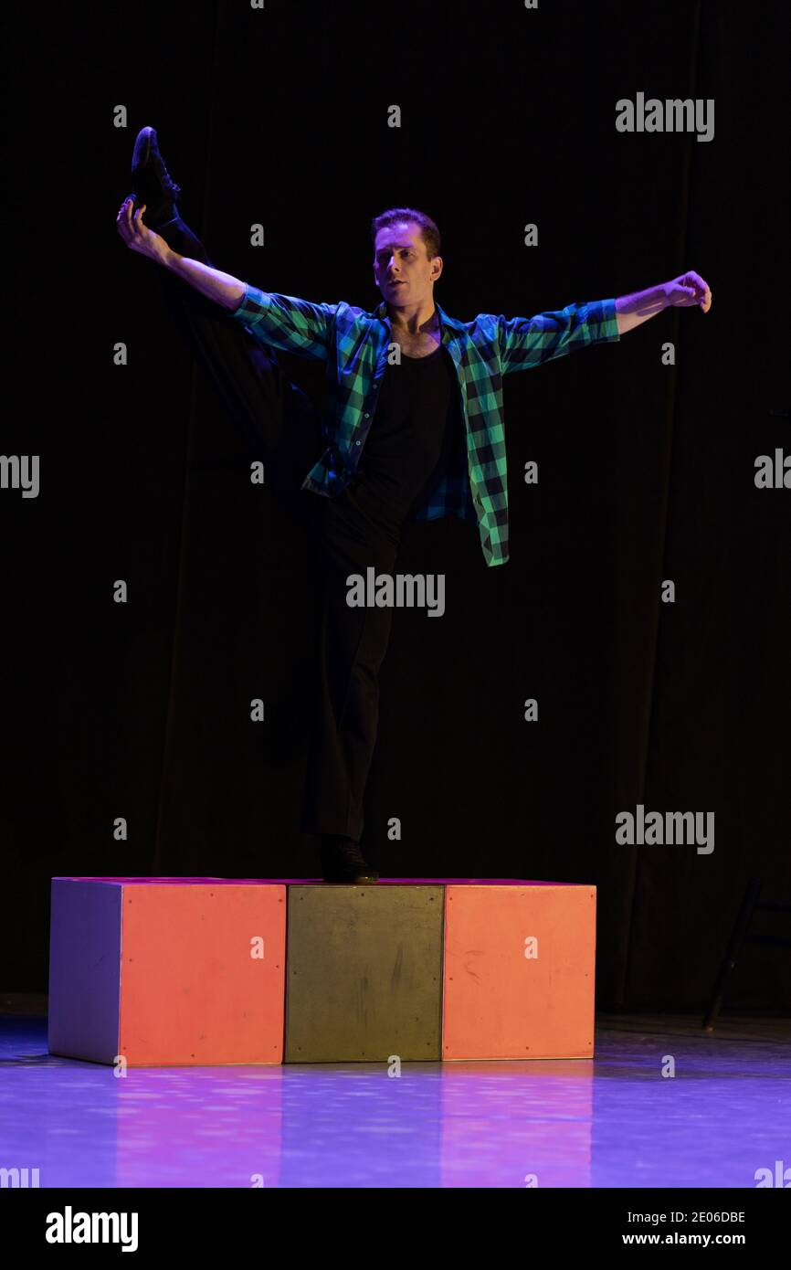 Actor dancer young man performs in the theater on stage in a dance ...