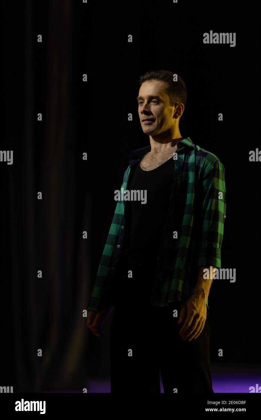Actor dancer young man performs in the theater on stage in a dance ...