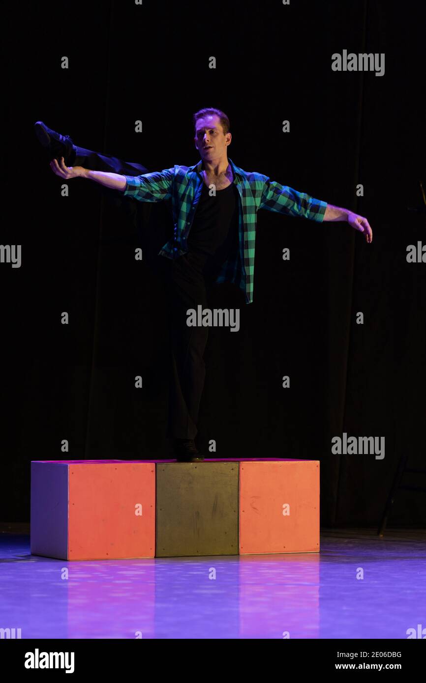 Actor dancer young man performs in the theater on stage in a dance ...