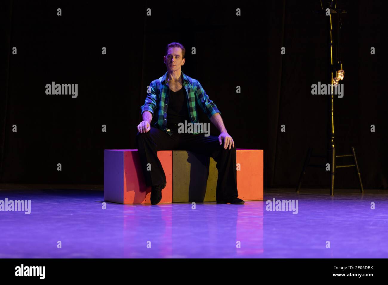 Actor dancer young man performs in the theater on stage in a dance ...