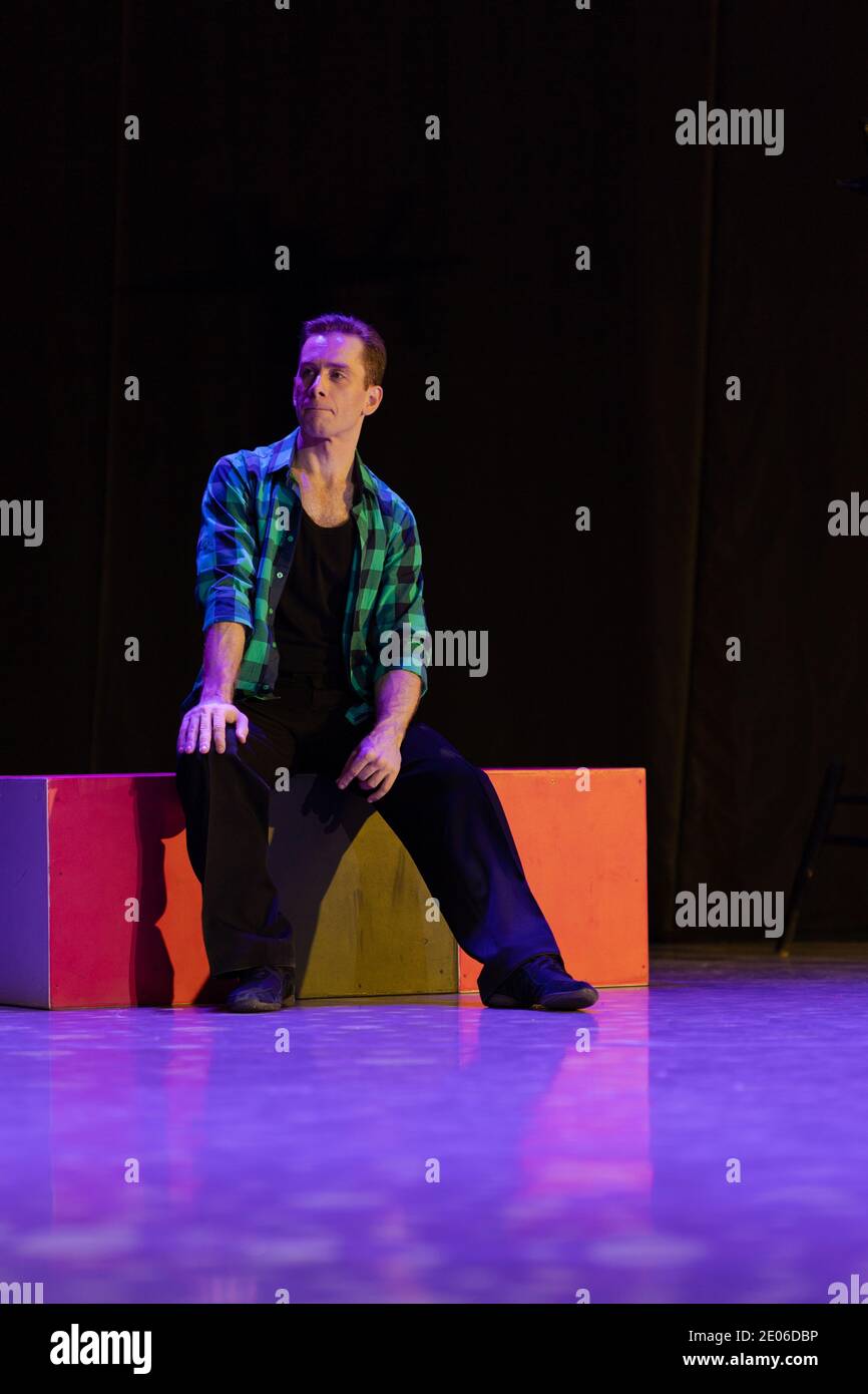 Actor dancer young man performs in the theater on stage in a dance ...
