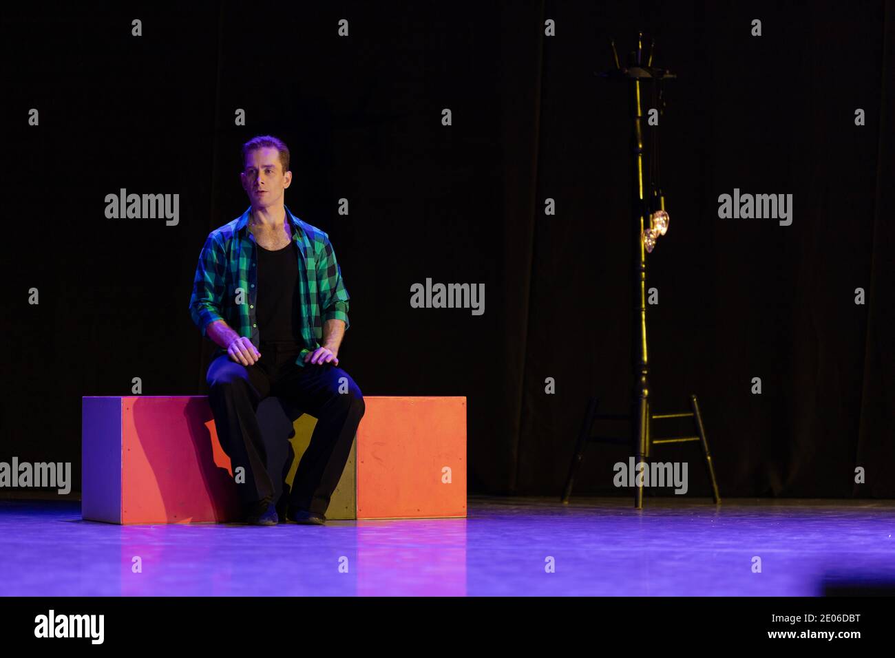 Actor dancer young man performs in the theater on stage in a dance ...