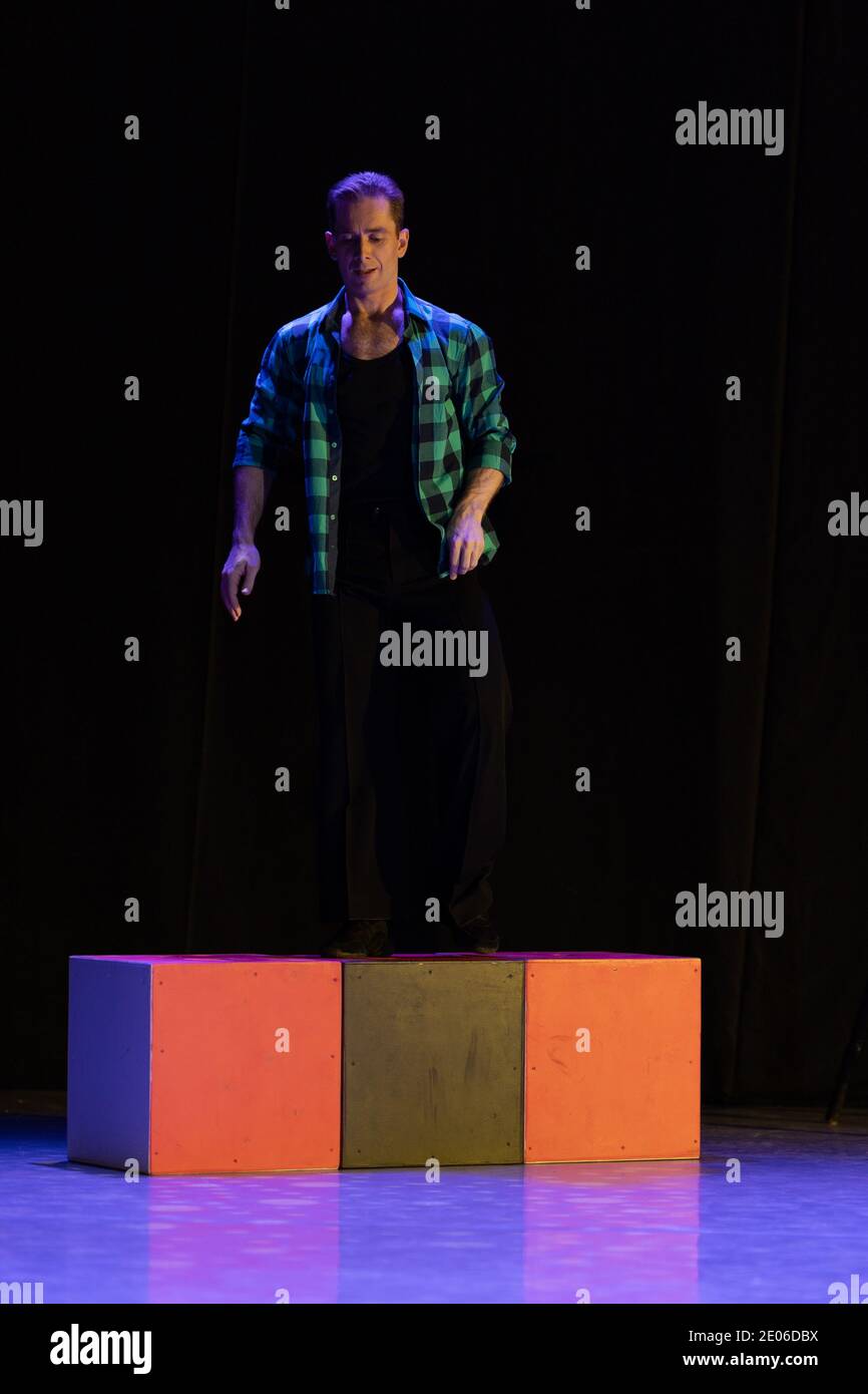 Actor dancer young man performs in the theater on stage in a dance ...