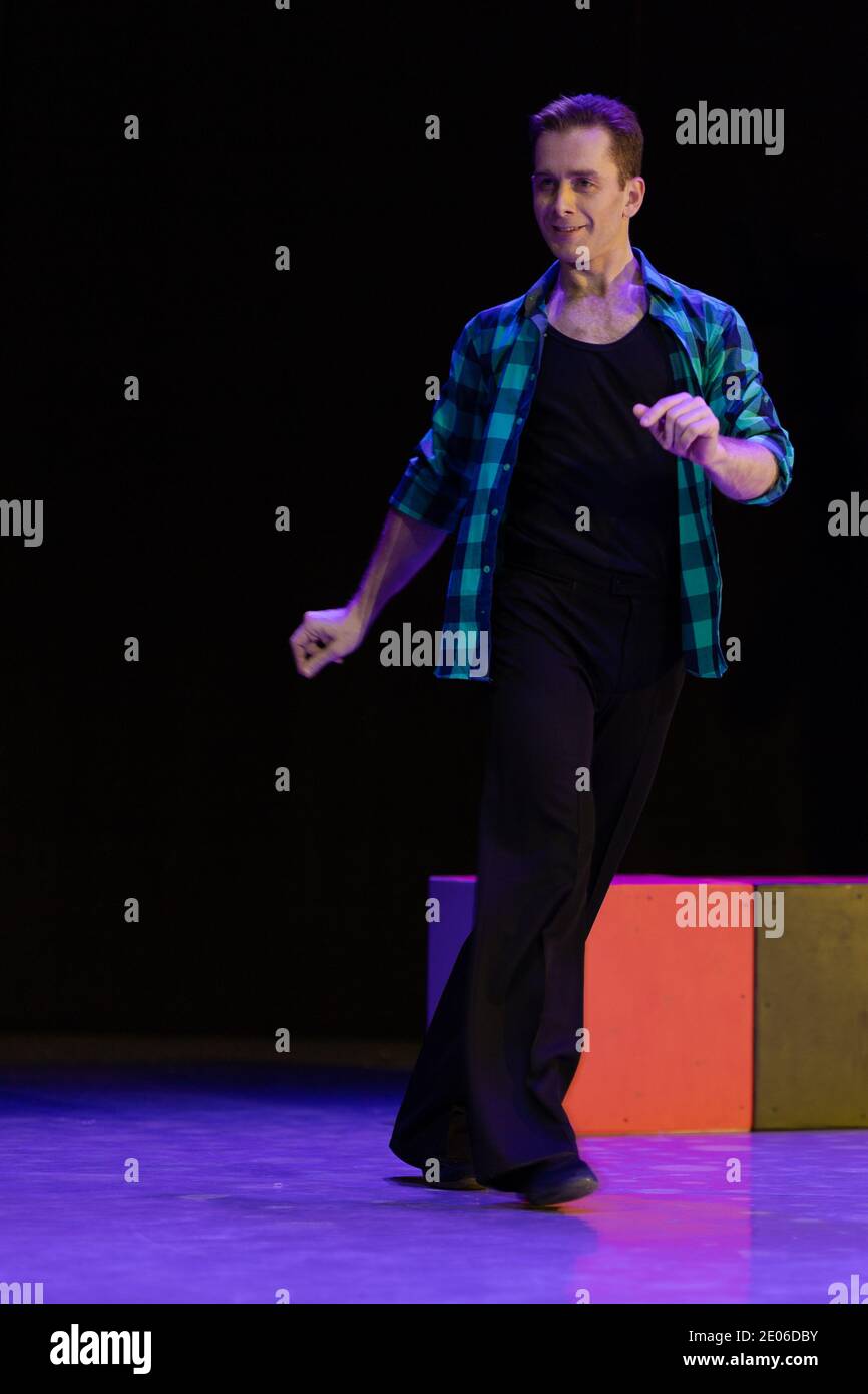 Actor dancer young man performs in the theater on stage in a dance ...