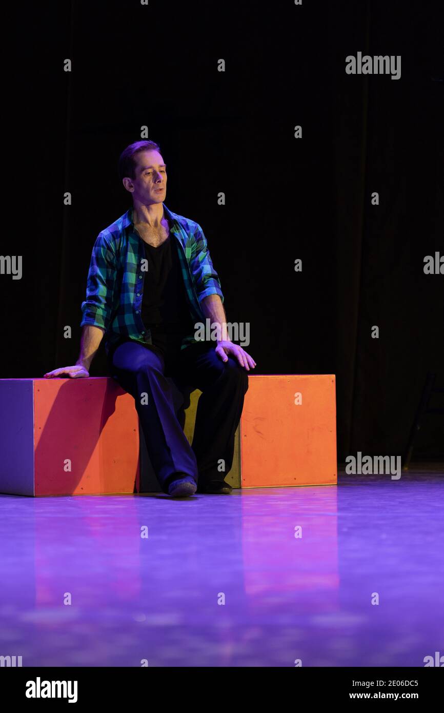 Actor dancer young man performs in the theater on stage in a dance ...