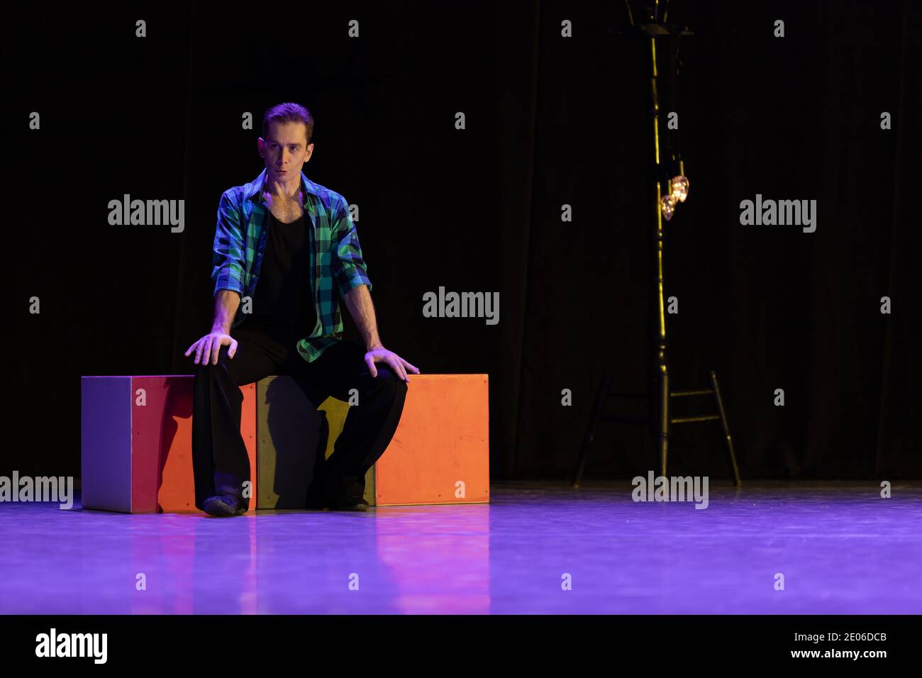 Actor dancer young man performs in the theater on stage in a dance ...