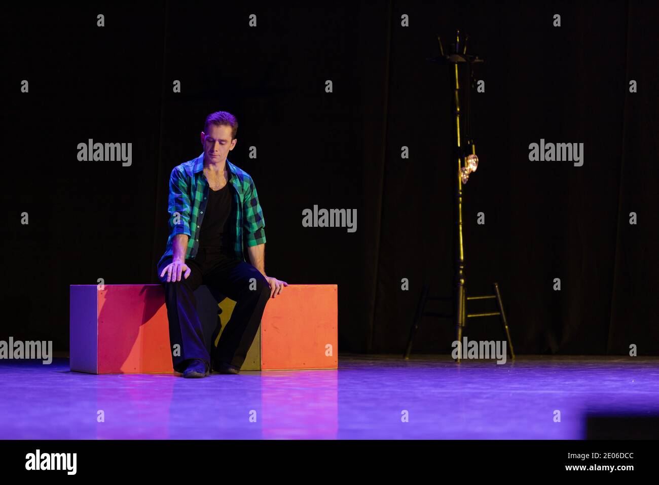 Actor dancer young man performs in the theater on stage in a dance ...