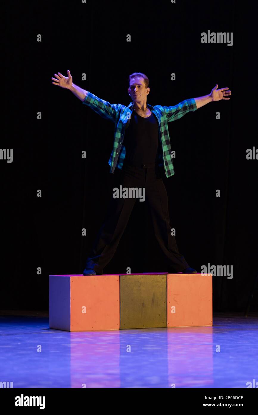 Actor dancer young man performs in the theater on stage in a dance ...