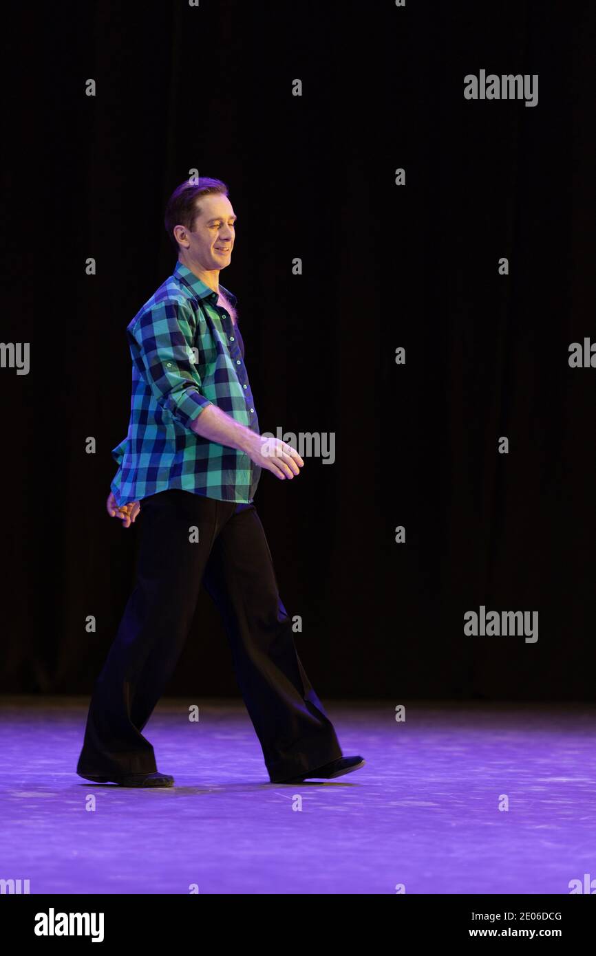 Actor dancer young man performs in the theater on stage in a dance ...