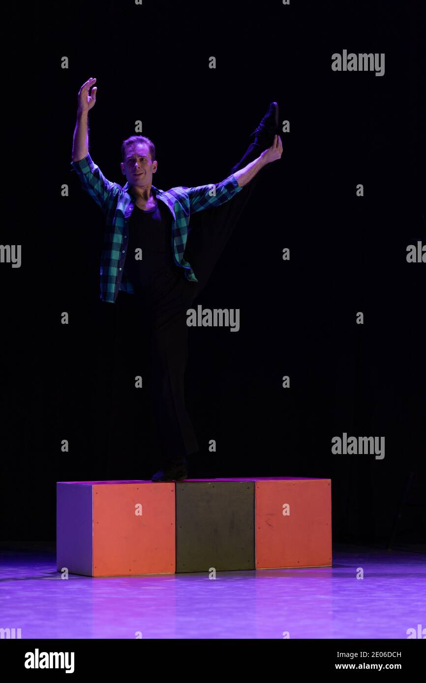 Actor dancer young man performs in the theater on stage in a dance ...