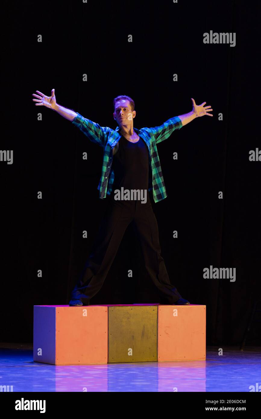 Actor dancer young man performs in the theater on stage in a dance ...