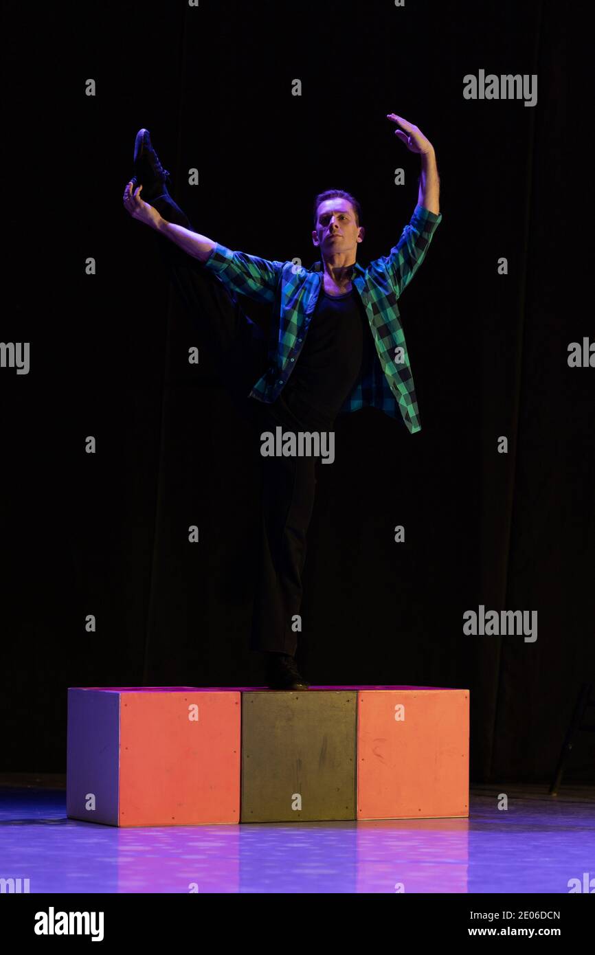 Actor dancer young man performs in the theater on stage in a dance ...