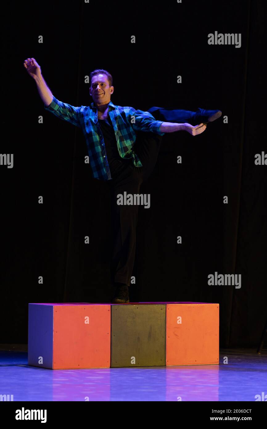 Actor dancer young man performs in the theater on stage in a dance ...