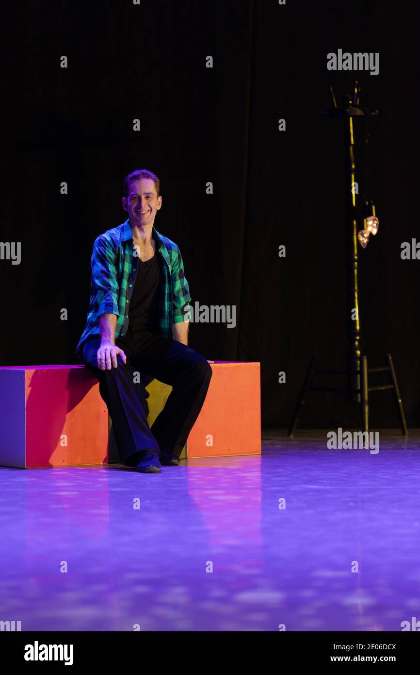 Actor dancer young man performs in the theater on stage in a retro ...