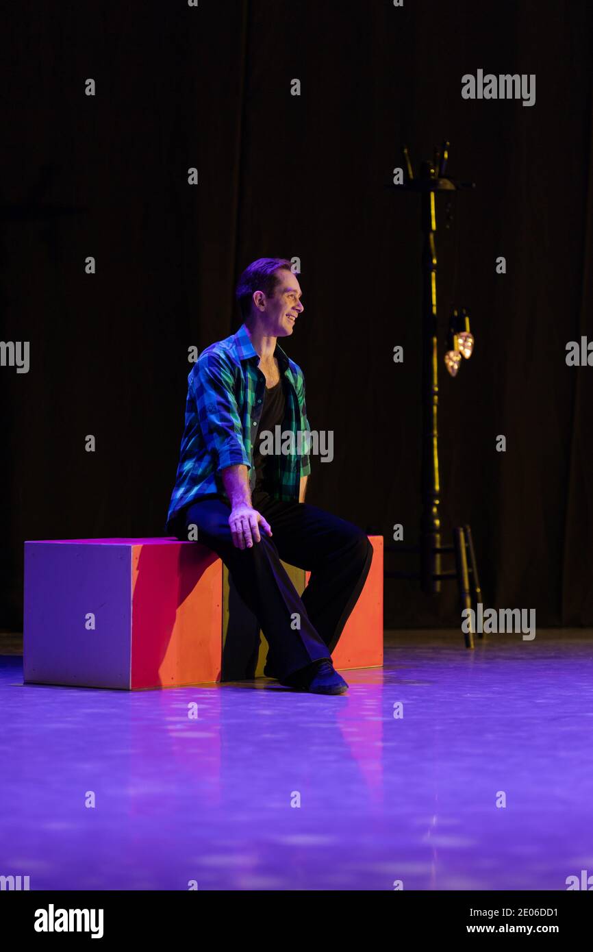 Actor dancer young man performs in the theater on stage in a dance ...